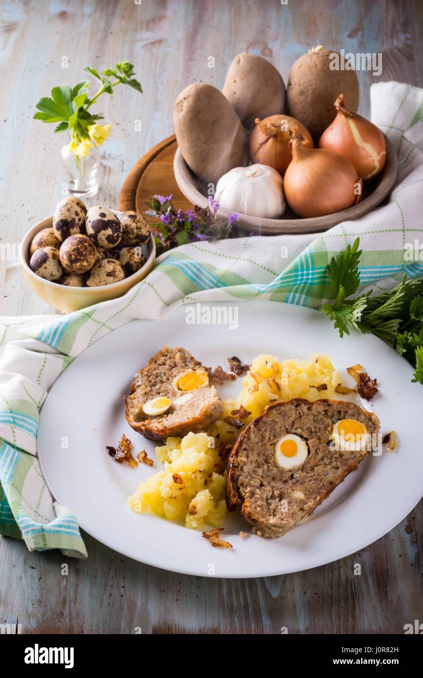 Vertical photo with two slices of homemade Easter meatloaf which is ...