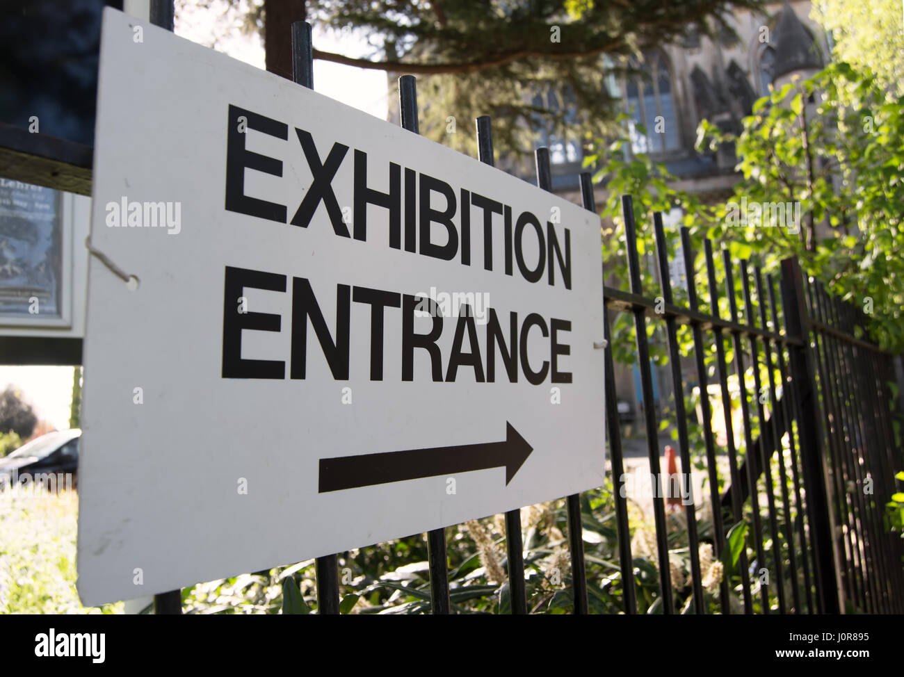 exhibition entrance sign with right pointing arrow Stock Photo - Alamy