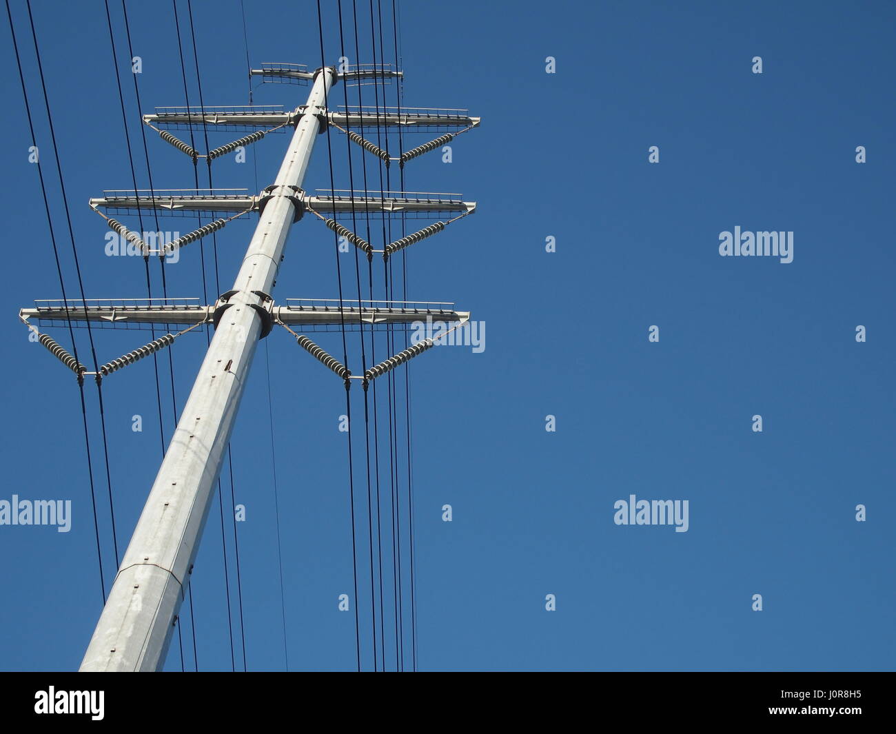 high voltage mono pole transmission line Stock Photo - Alamy