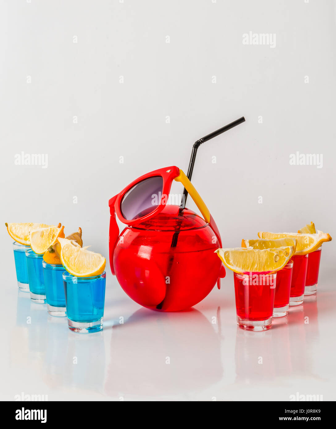 Exotic drink in a ball-shaped glass, eight drinks in a shotglass ...