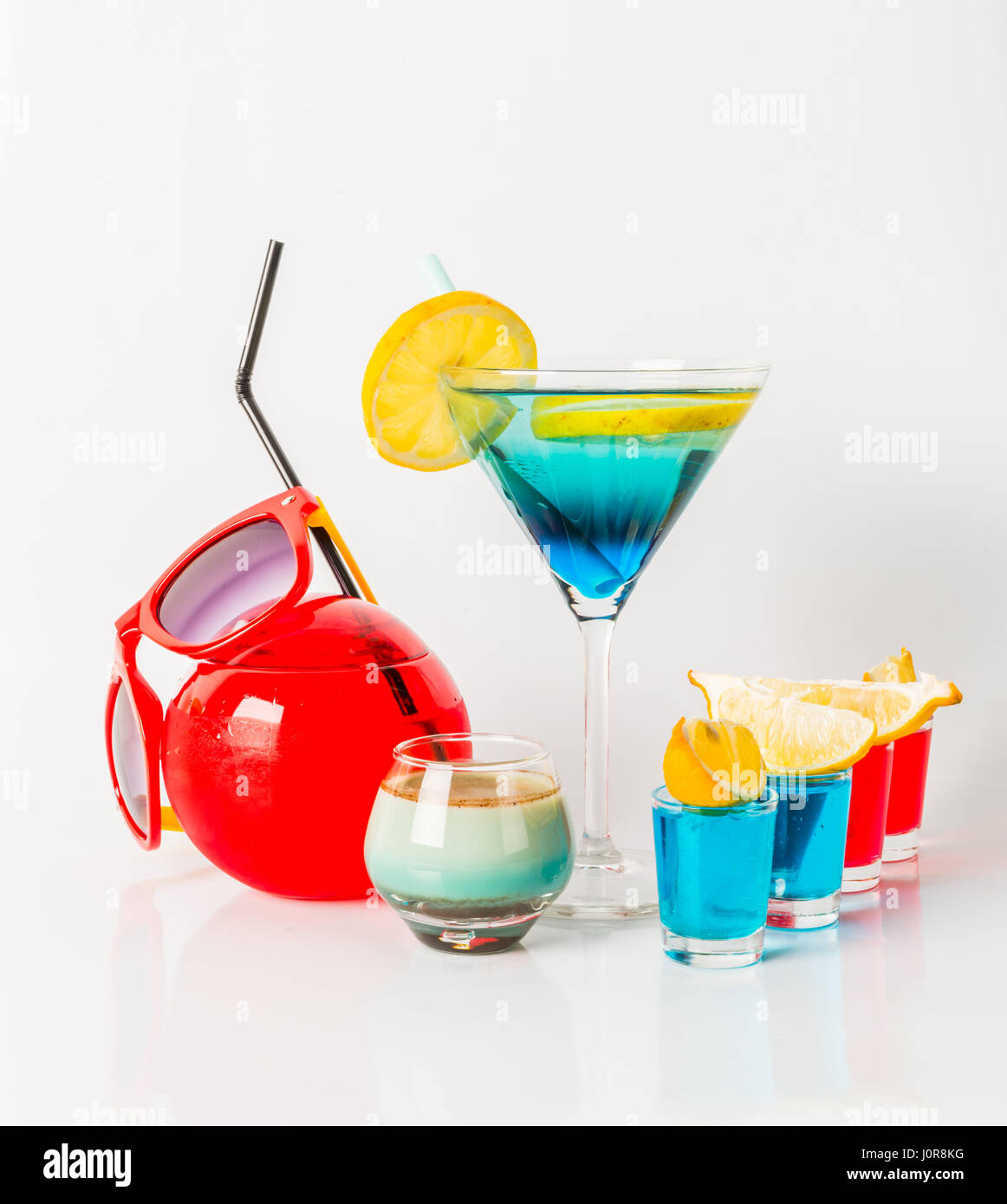 Colorful drink in a martini glass, blue and green combination, four ...