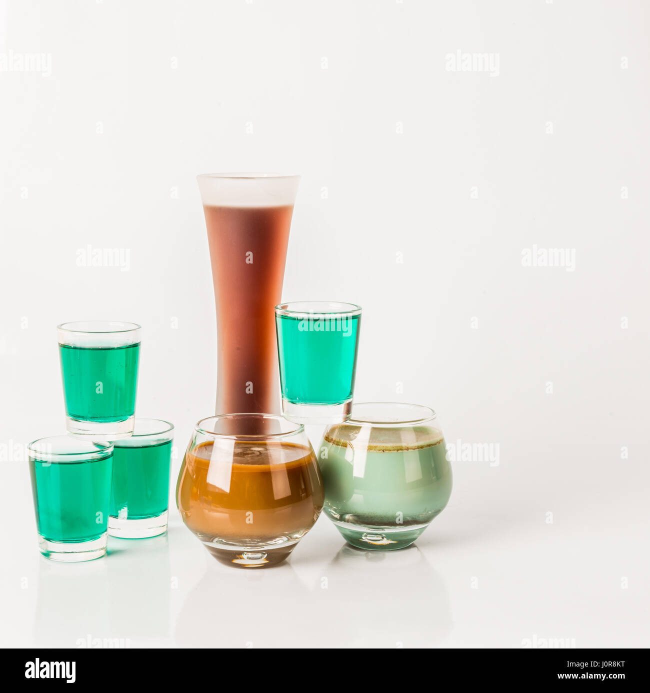 Seven color drink shots, different glass shapes, green and brown shots ...