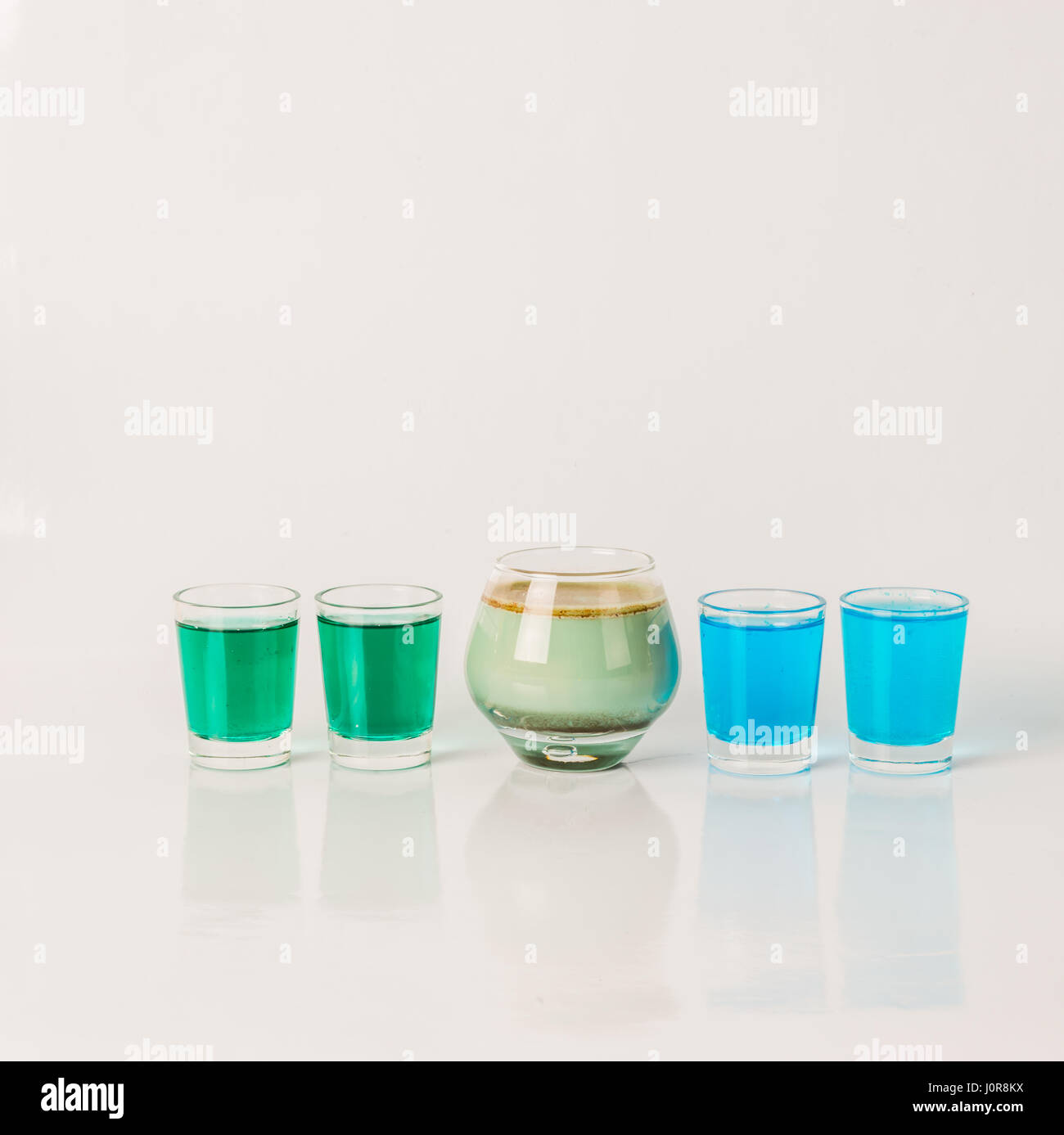 Five color drink shots, different glass shapes, blue, green and ...