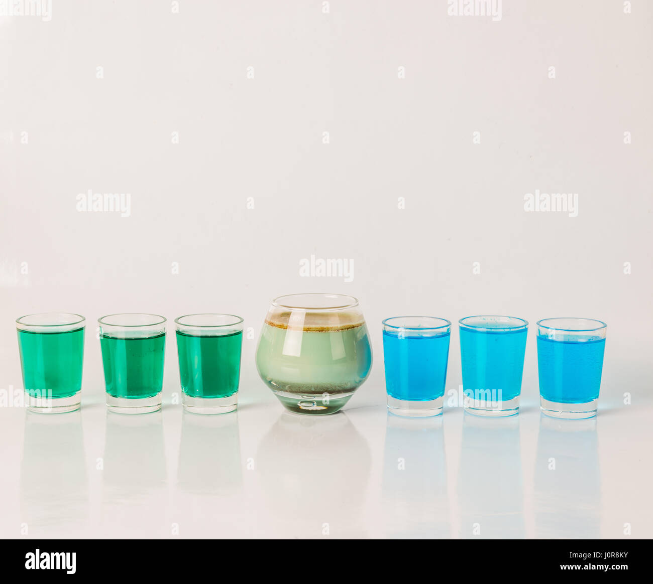Seven color drink shots, different glass shapes, blue, green and ...