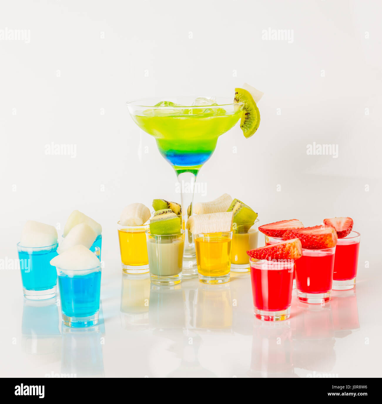 Colorful drink in a margarita glass, blue and green combination, many ...