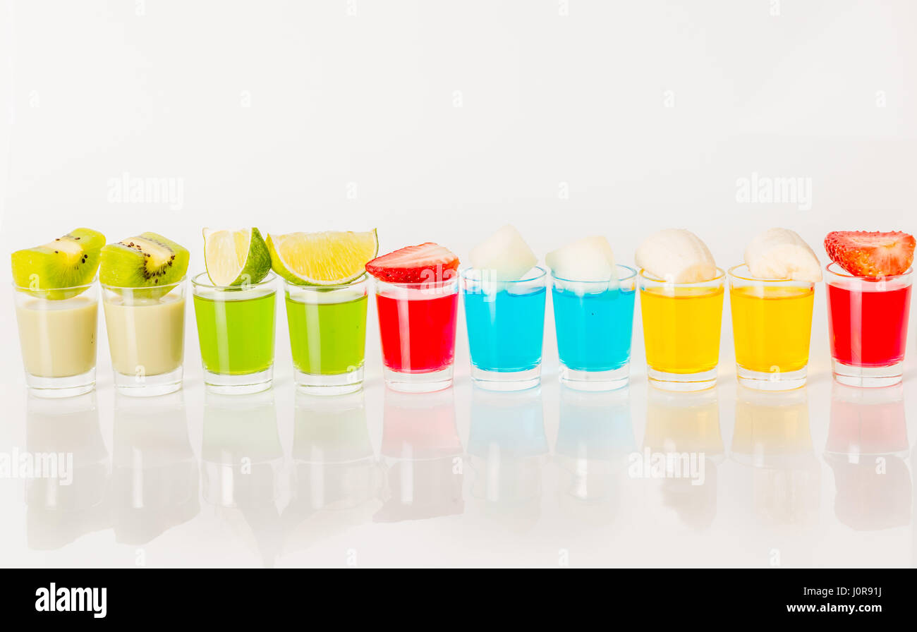 Color drinks in shot glass, blue, green, red, yellow and creamy ...