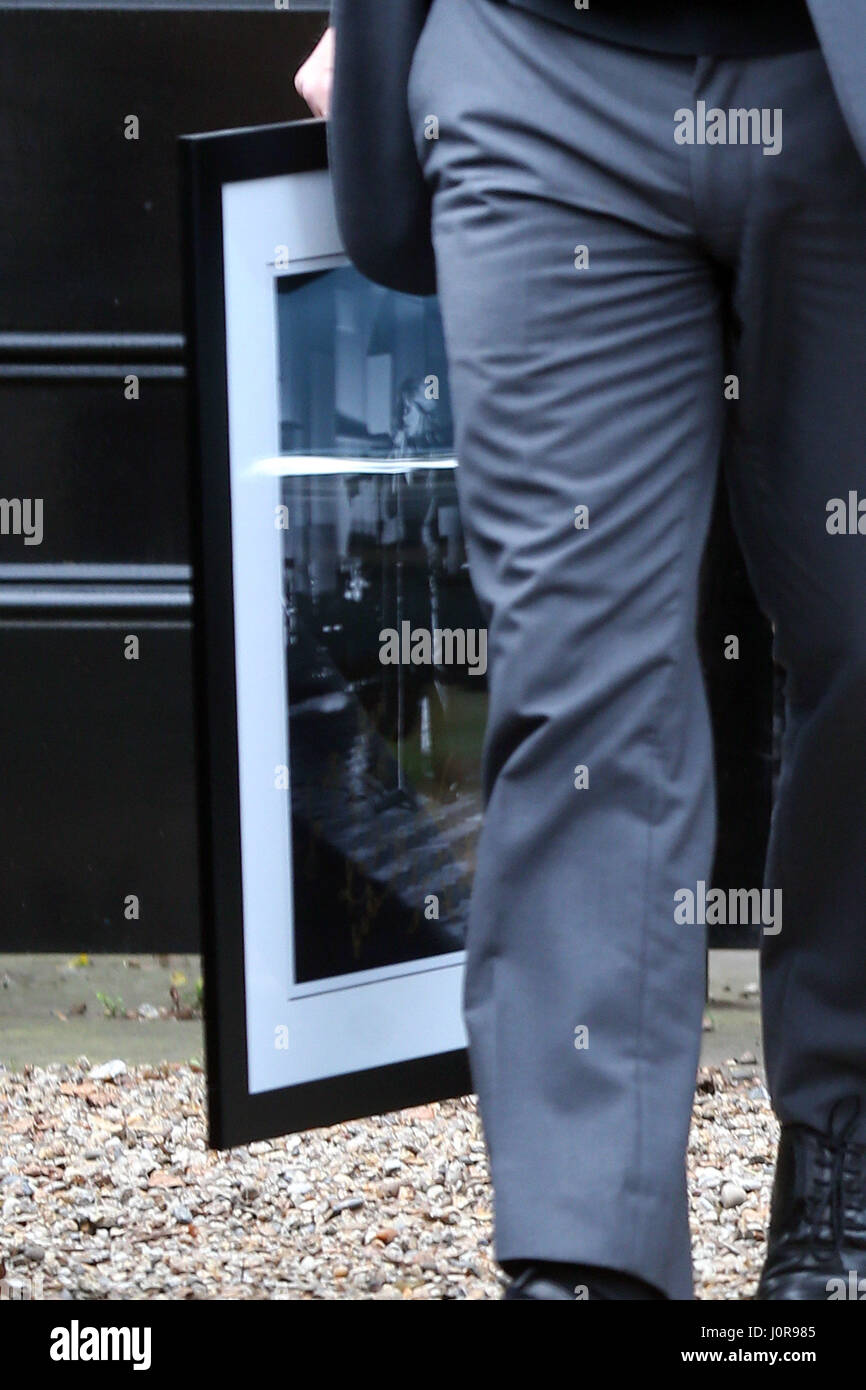 Kate Moss leaves her North London home with her driver carrying what ...
