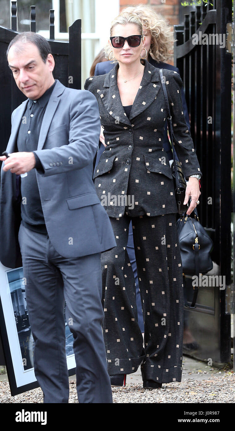 Kate Moss leaves her North London home with her driver carrying what ...