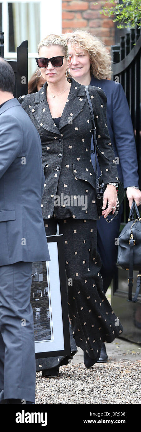 Kate Moss leaves her North London home with her driver carrying what ...