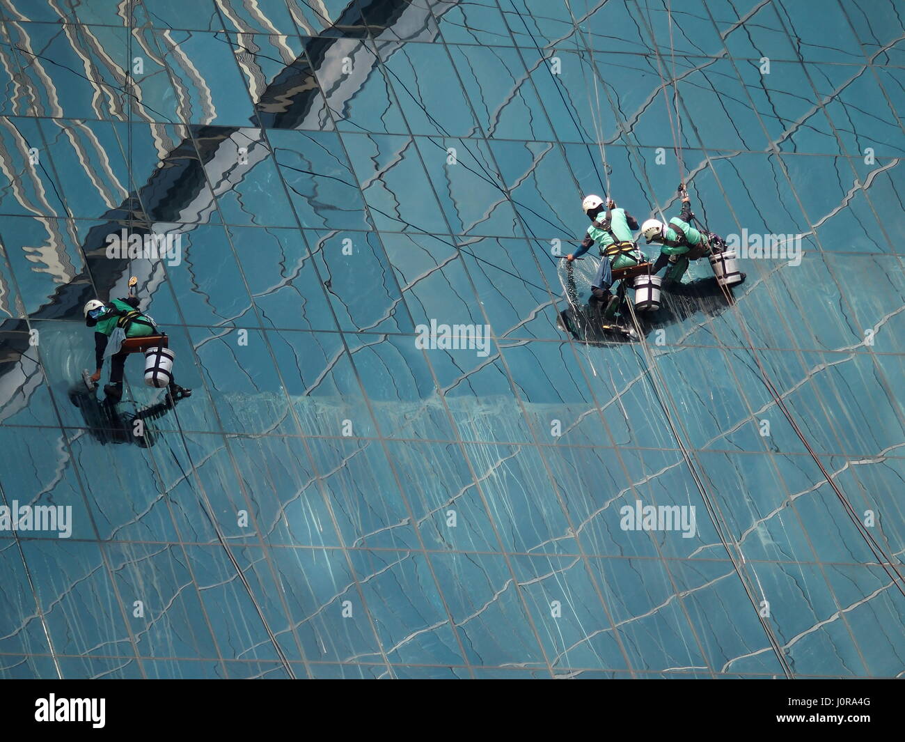 Men cleaning glass building Stock Photo - Alamy