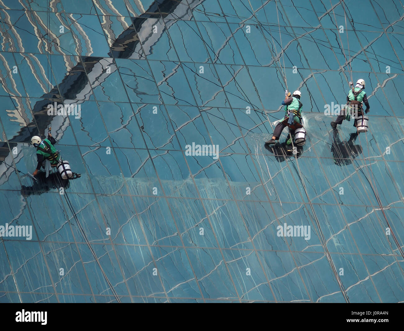 men cleaning glass building Stock Photo - Alamy