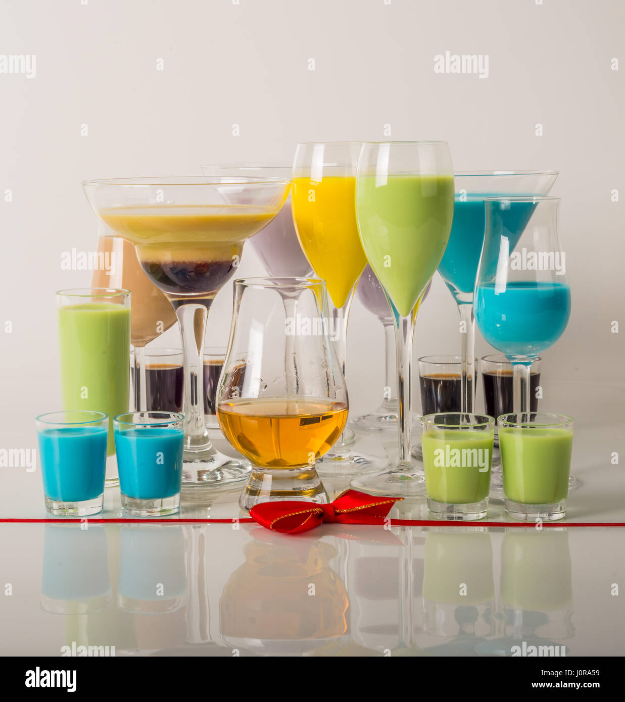 Colorful drinks based on milk liqueurs, unique pastel colors of drinks ...