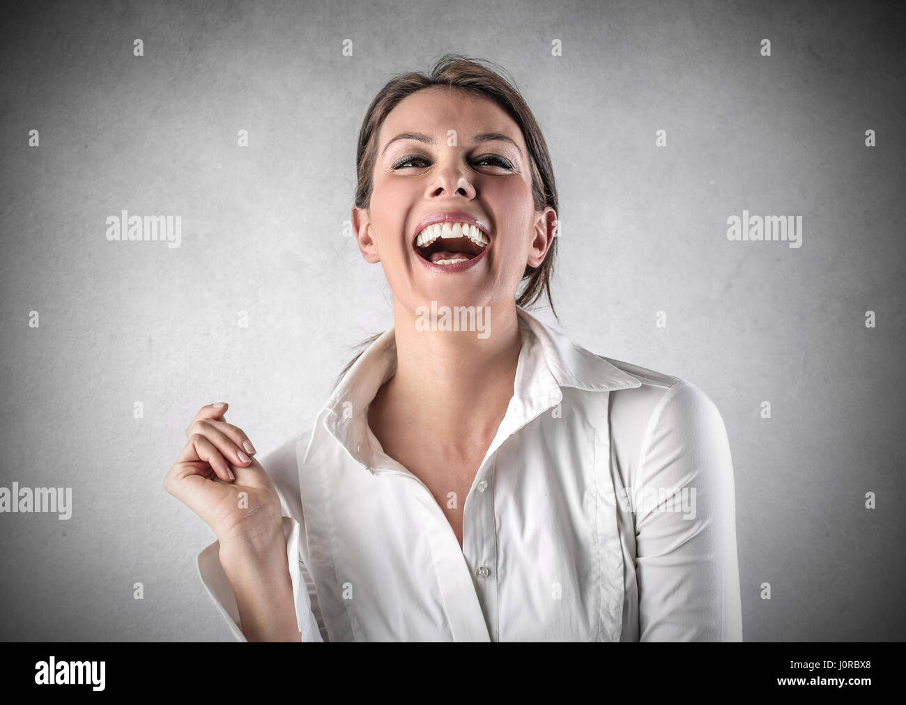 businesswoman laughing inside Stock Photo - Alamy