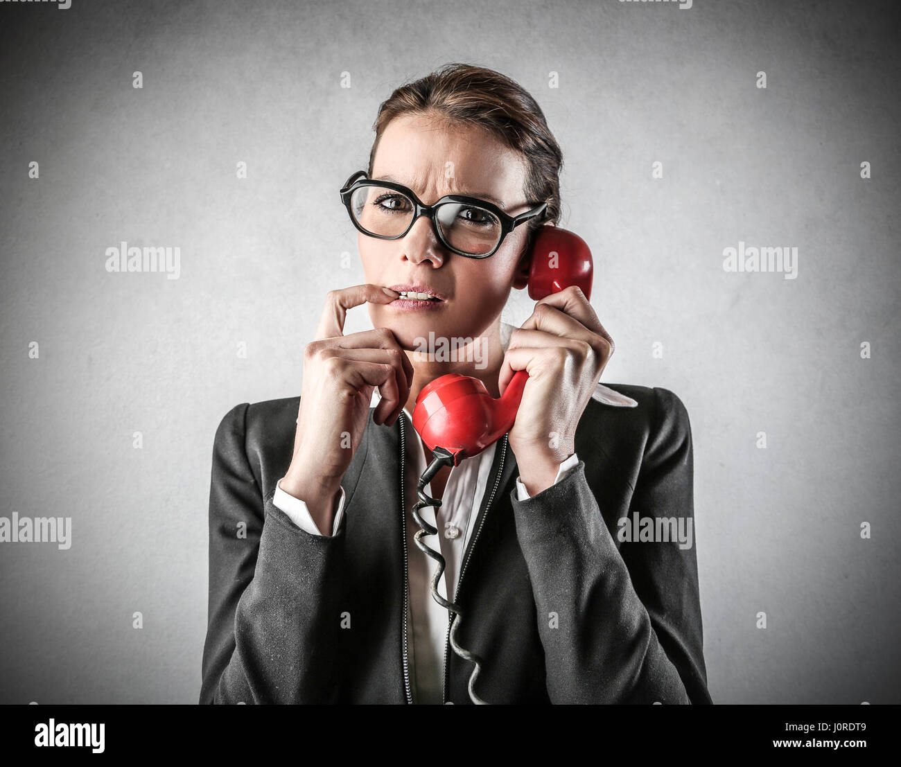 Businesswoman being confused while making a call Stock Photo - Alamy