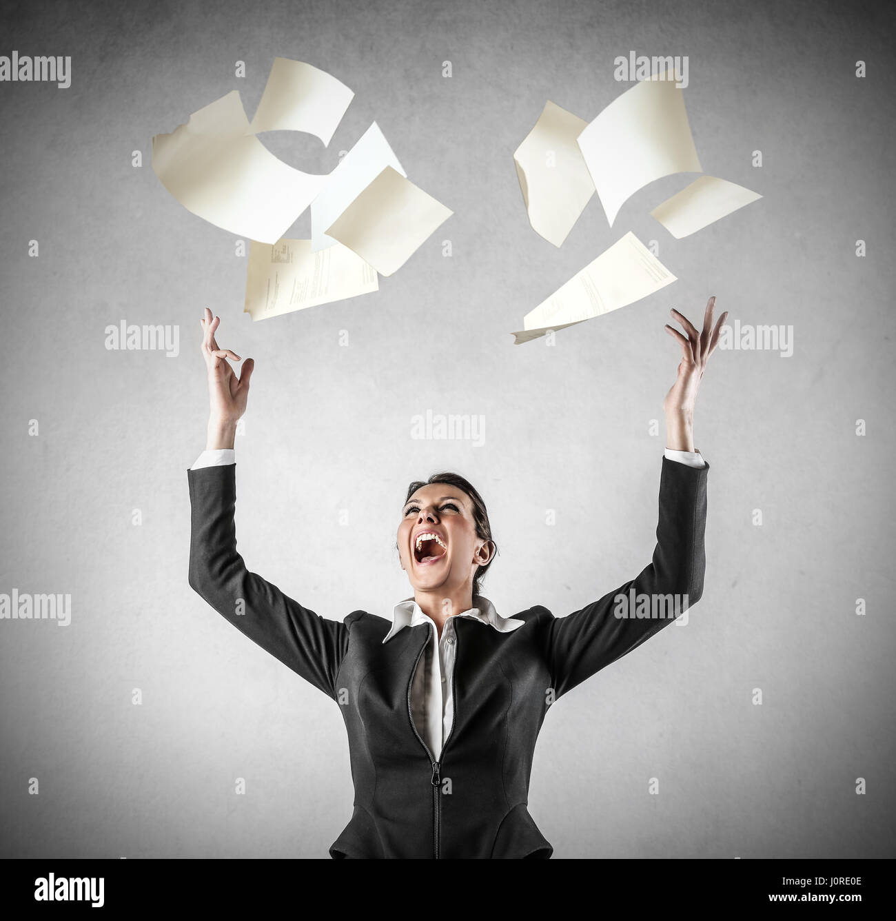 Businesswoman throwing out her papers Stock Photo - Alamy