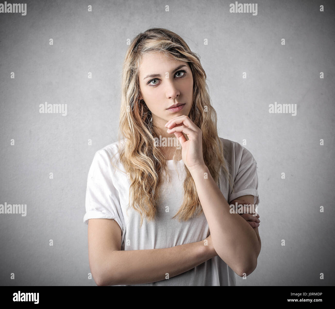 Blond woman thinking inside Stock Photo - Alamy