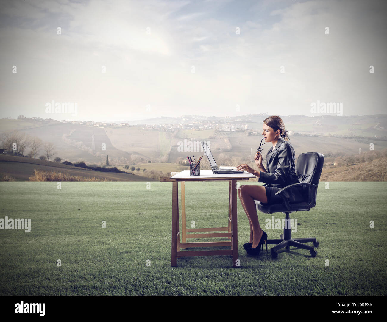 Businesswoman working in the nature Stock Photo - Alamy
