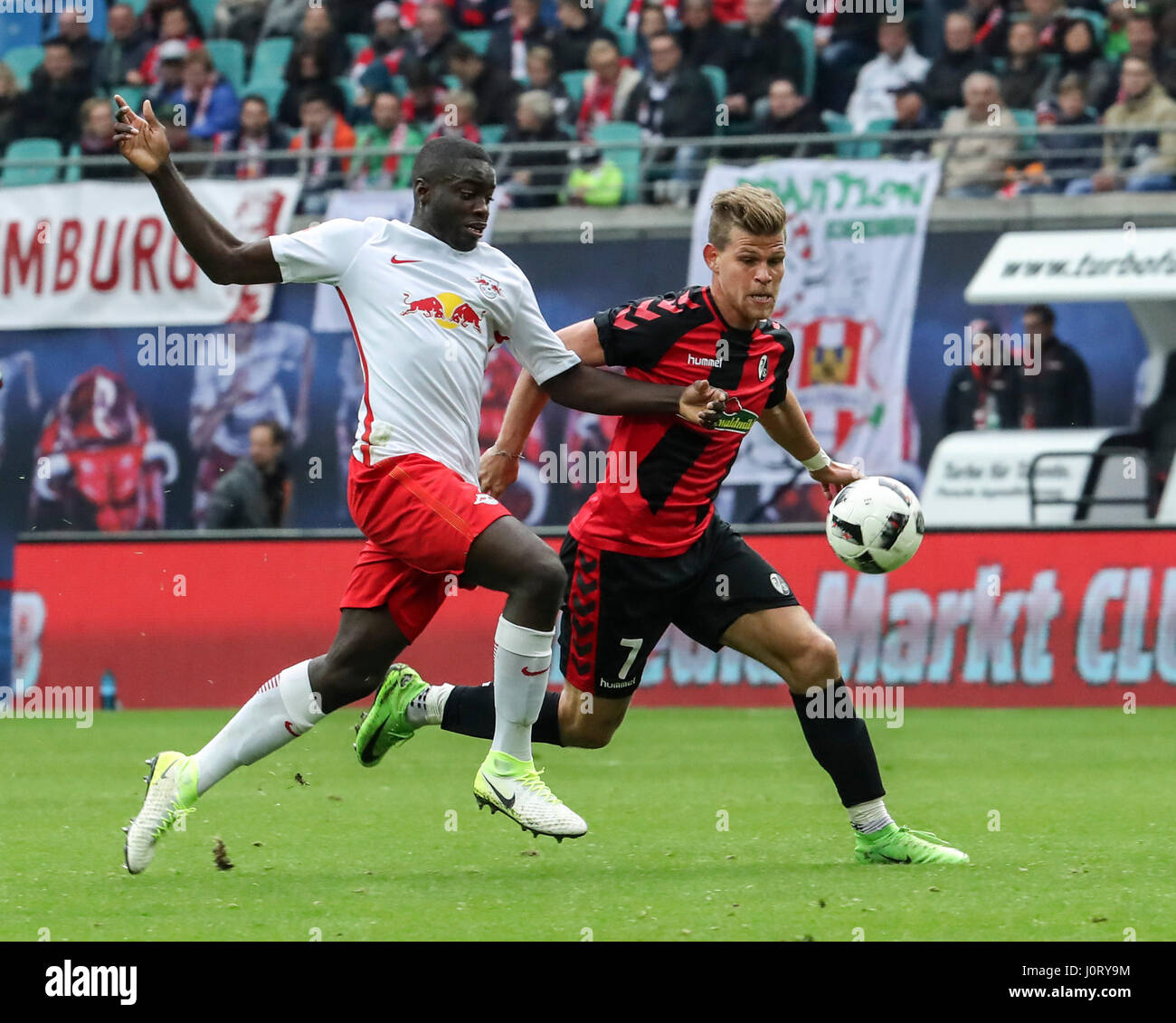 Leipzig, Germany. 15th Apr, 2017. RB Leipzig's Dayot Upamecano (L) vies ...