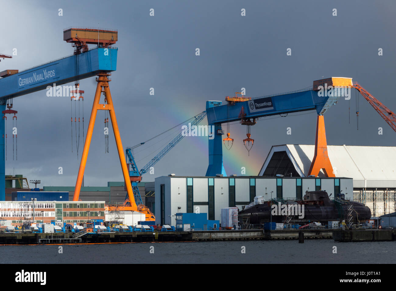 Kiel, Germany. 15th April 2017 Rainbow over the Kiel shipyard after a ...