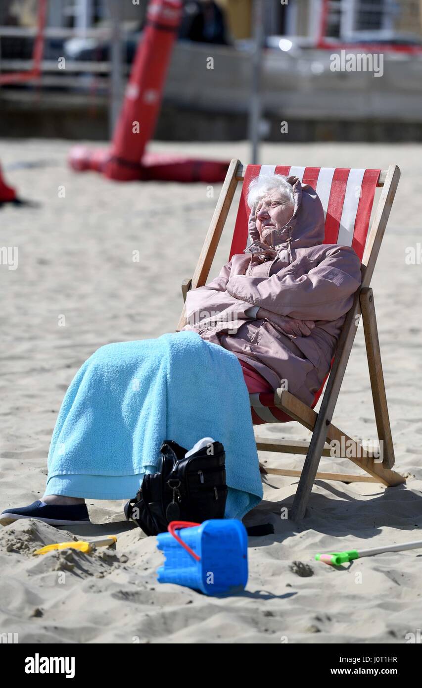 A lady has a nap on the beach Stock Photo - Alamy