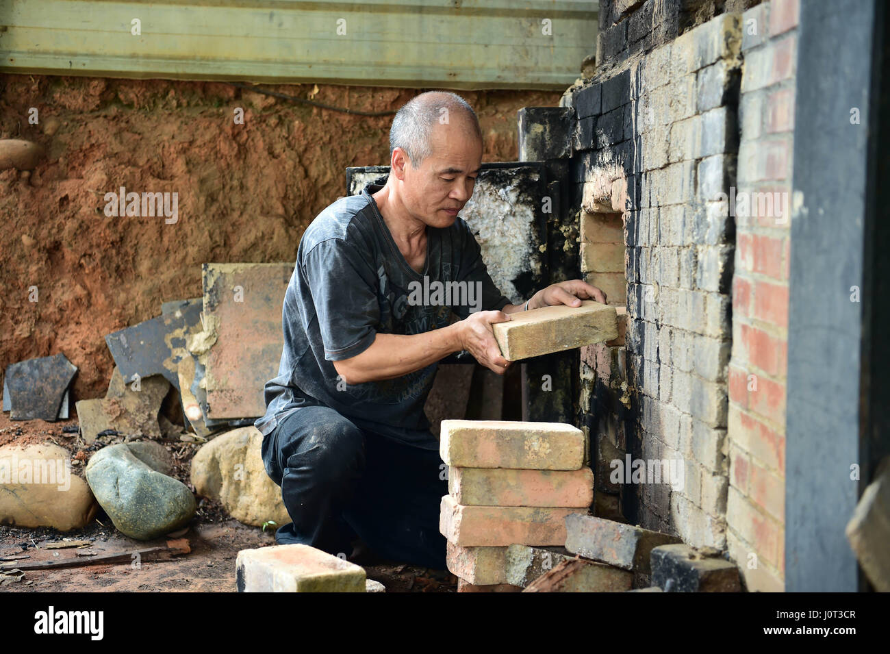 Taipei. 16th Apr, 2017. Ceramist Chen Chin Wang prepares to kiln ...