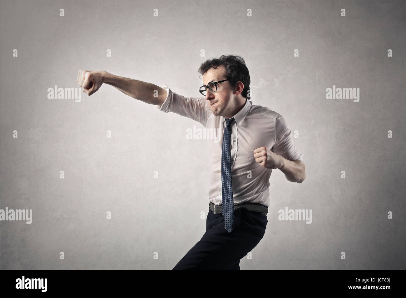 Businessman fighting inside Stock Photo - Alamy