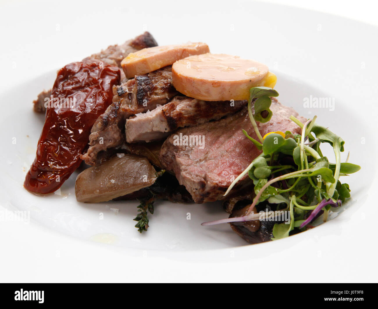 Roast beef served on a white dish Stock Photo - Alamy