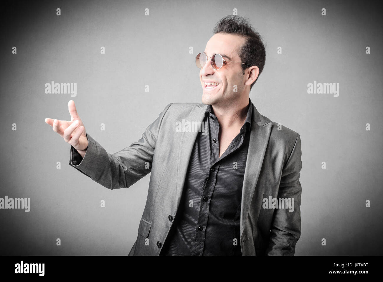 Elegant man talking inside Stock Photo - Alamy