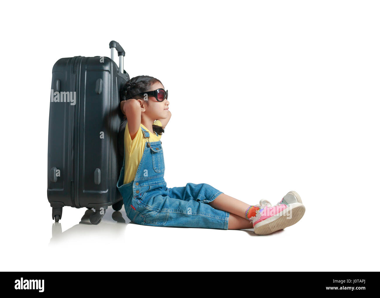 Asian little girl close her eyes for relaxing and sitting lean the ...