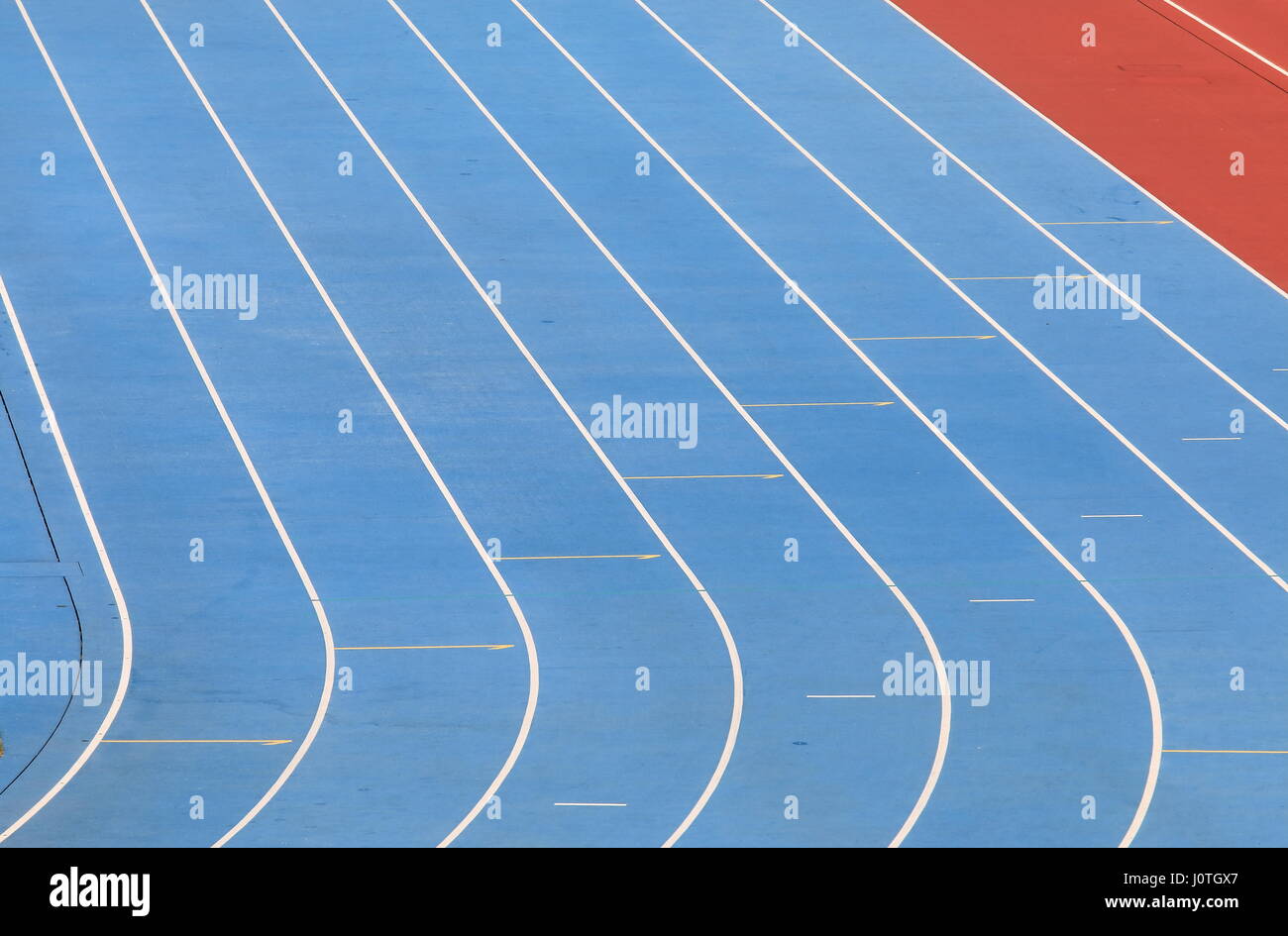 Running track field at sports stadium Stock Photo - Alamy