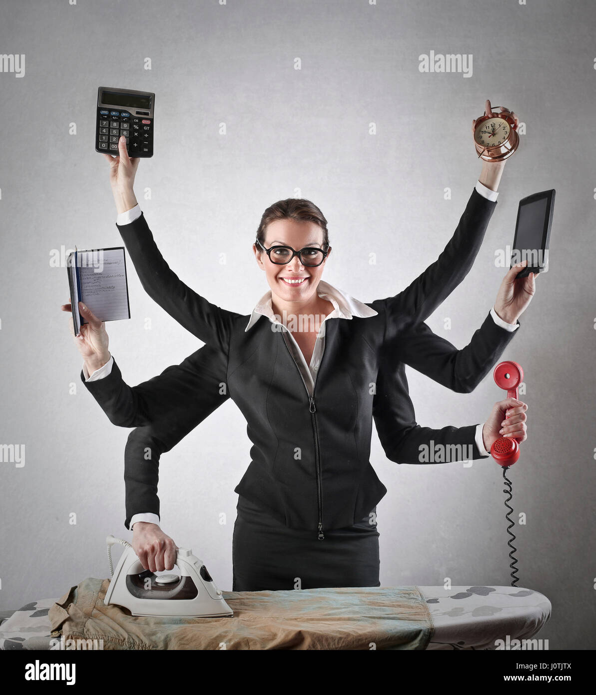 Businesswoman with 6 hands Stock Photo - Alamy