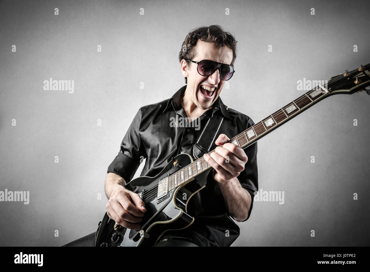 Pop star man guitar hi-res stock photography and images - Alamy