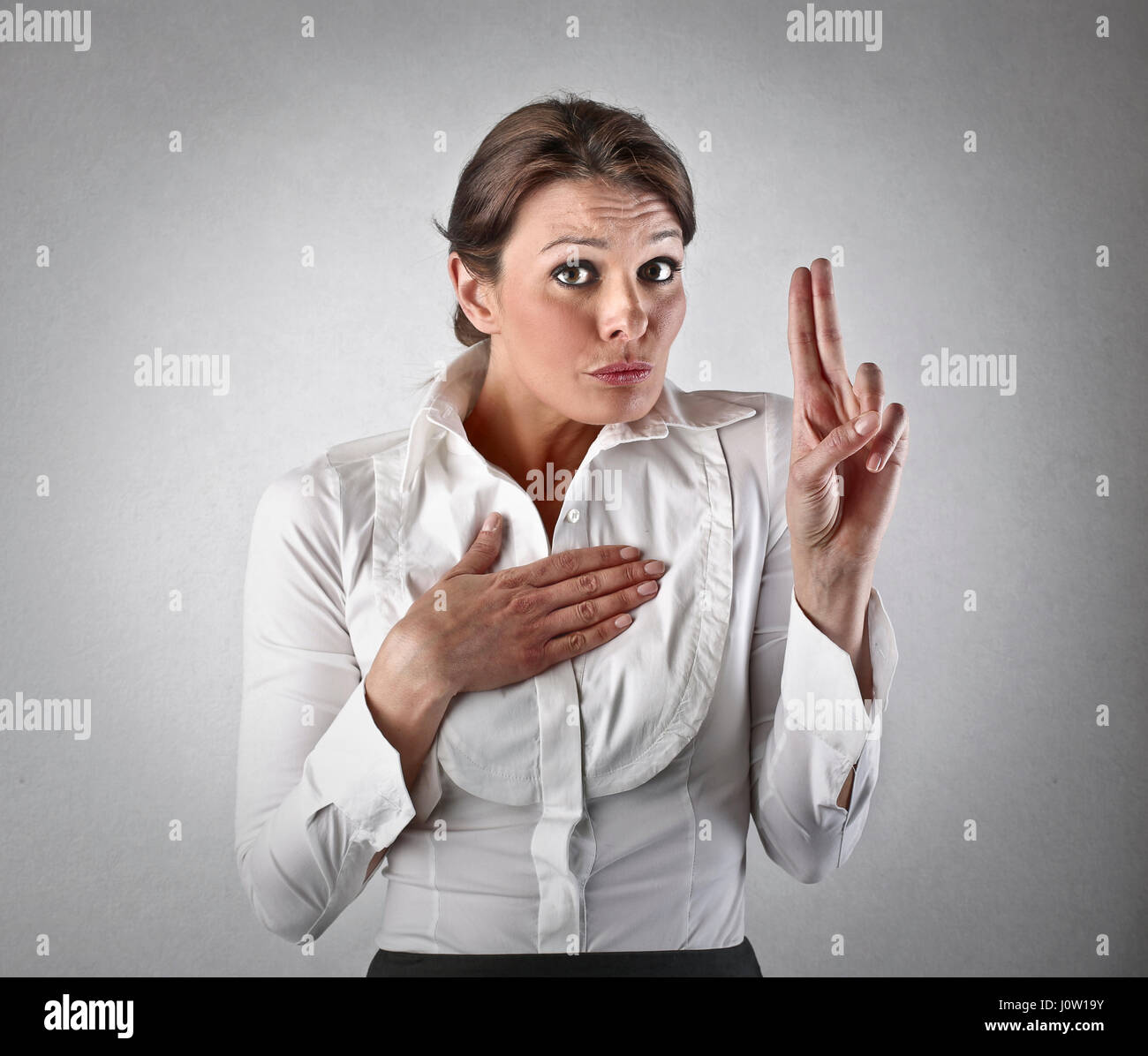 Woman taking an oath Stock Photo - Alamy