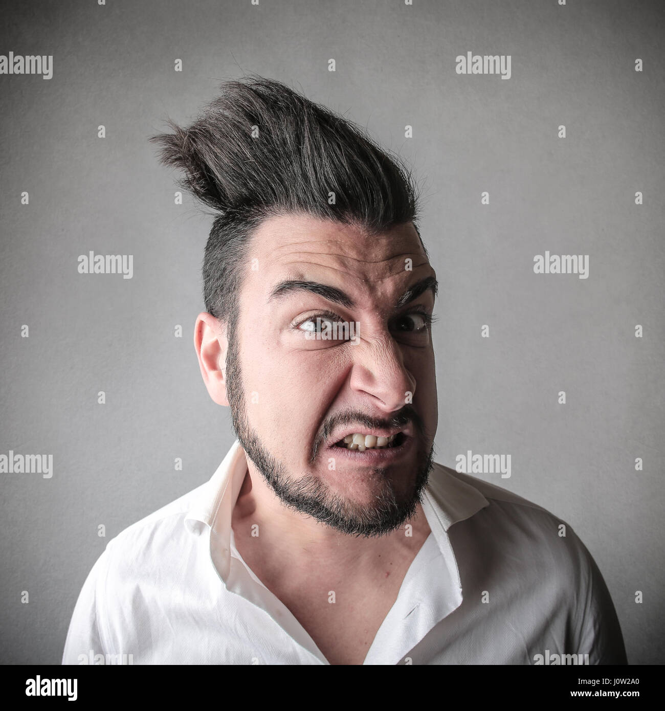 Angry guy making face hi-res stock photography and images - Alamy