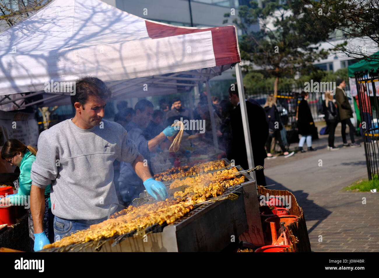 Street food stall serving ethnic food to office workers in the City of ...