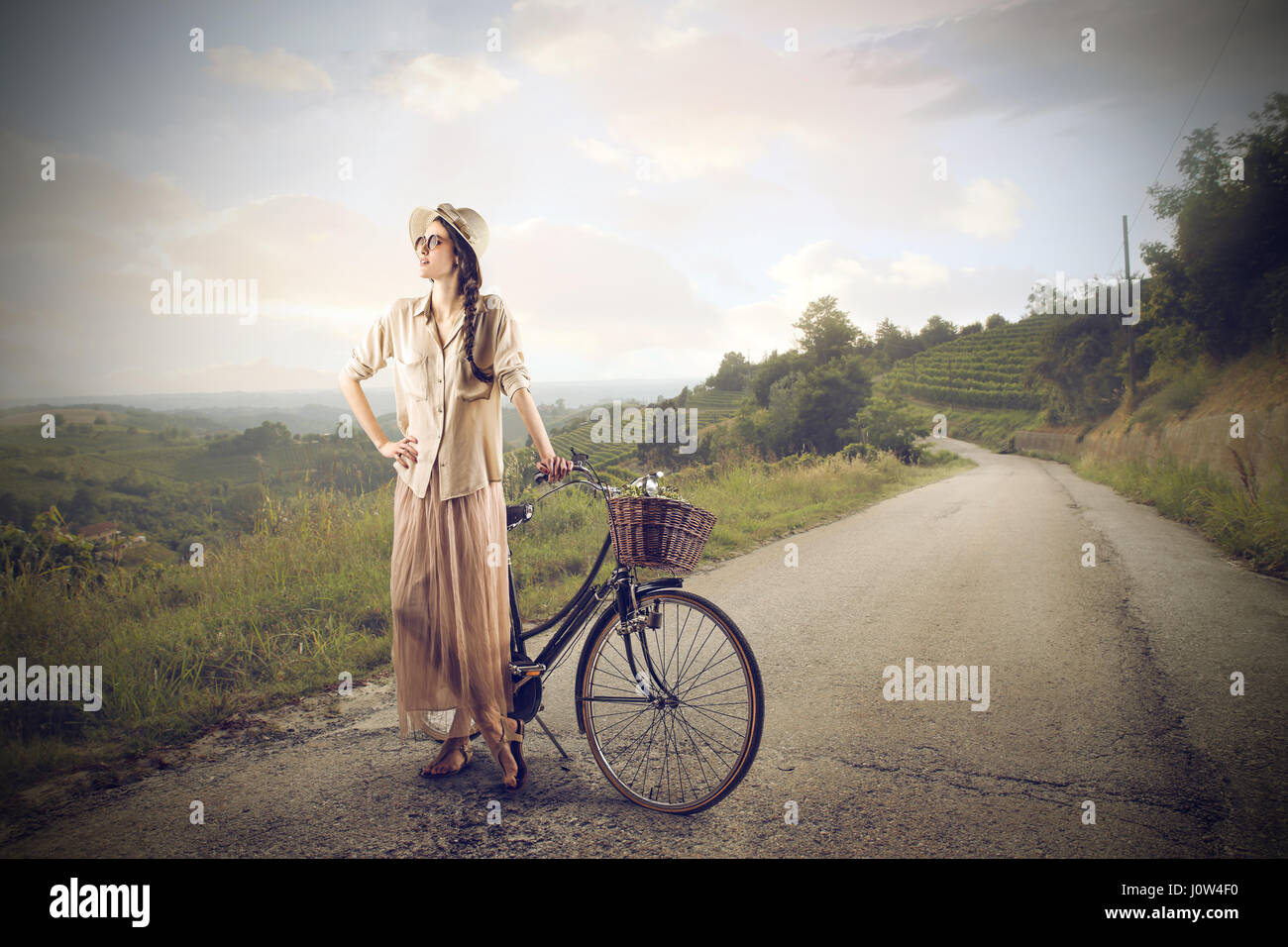 vintage woman with bike on the countryside Stock Photo - Alamy