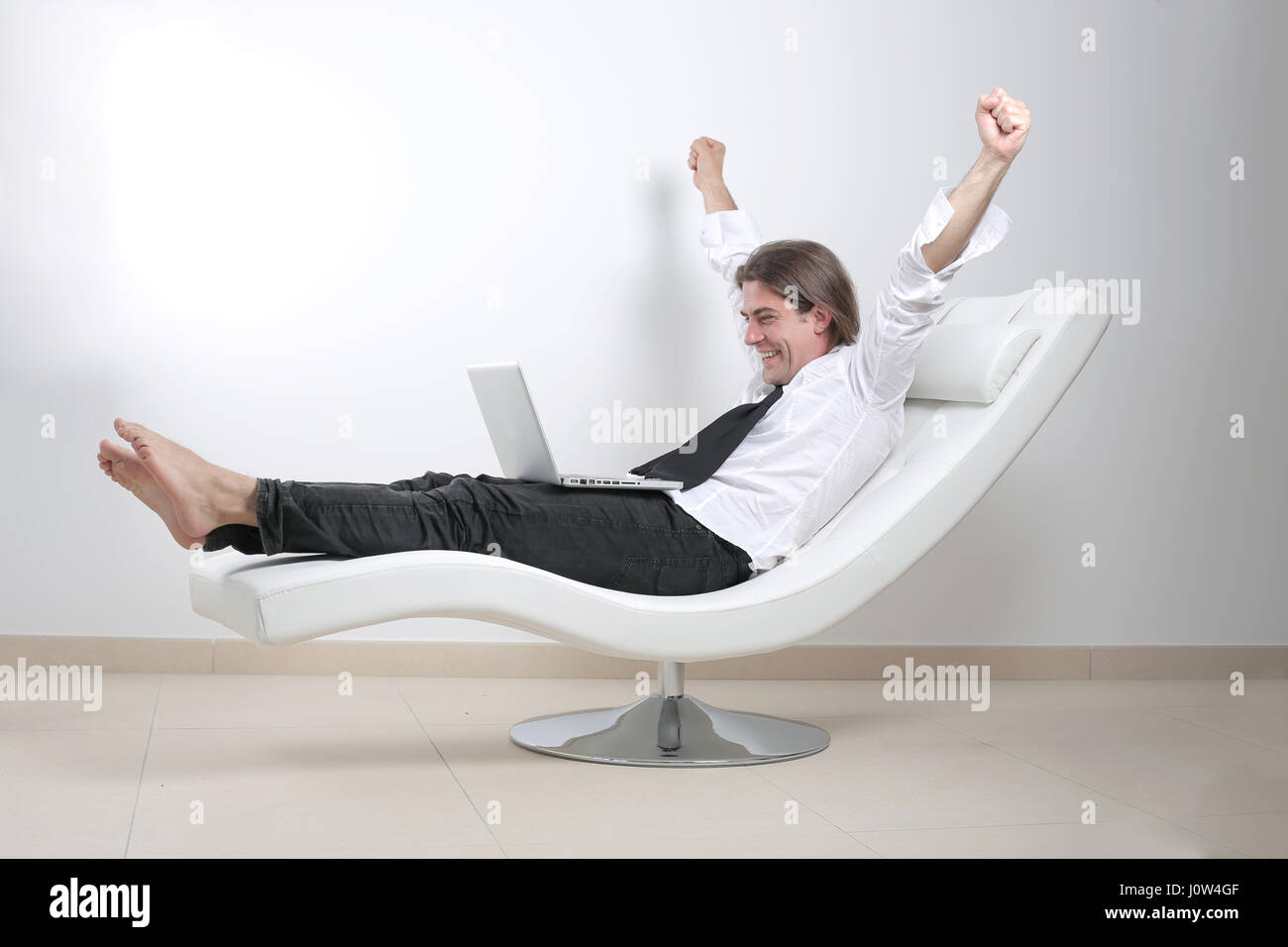 Portrait man lying on chair hi-res stock photography and images - Alamy