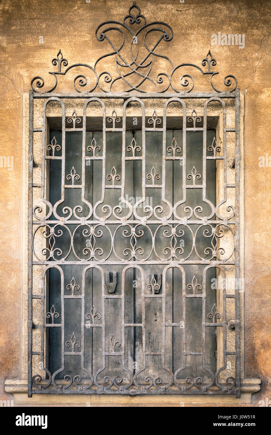 Window of an ancient Italian villa with artistic iron grill handmade ...