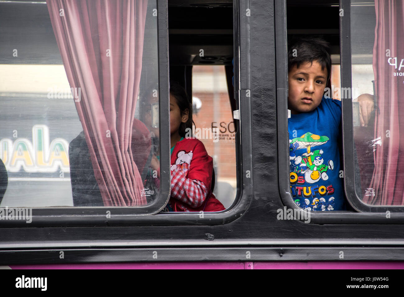 Boy looking out bus window hi-res stock photography and images - Alamy