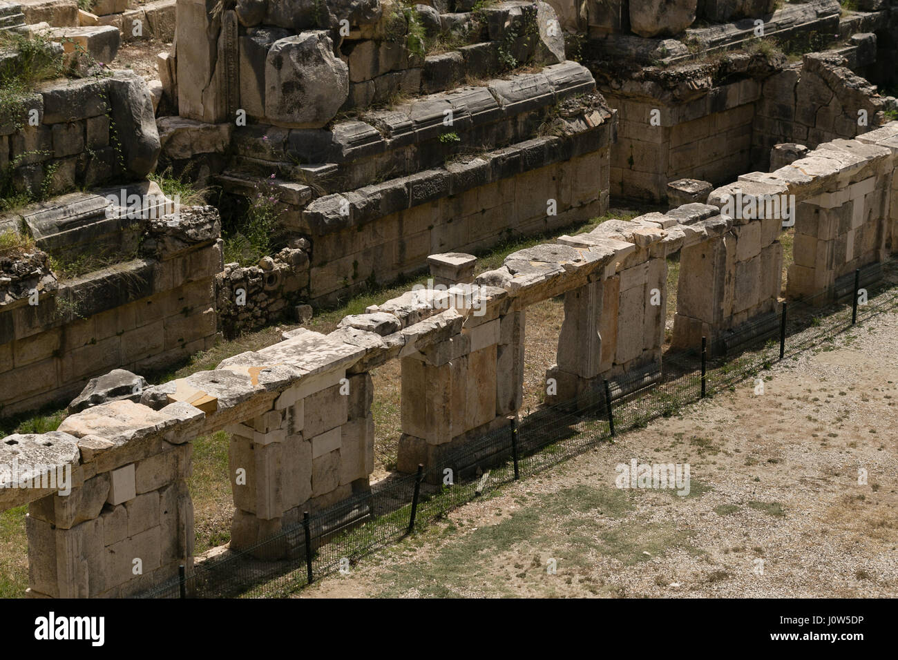 Stone walls of Lycian amphitheater in historical and archeological site ...