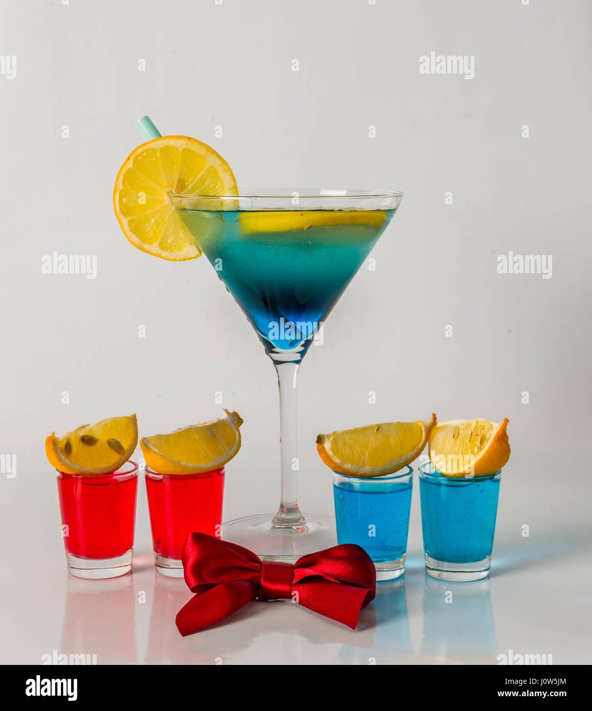 Colorful drink in a martini glass, blue and green combination, four ...