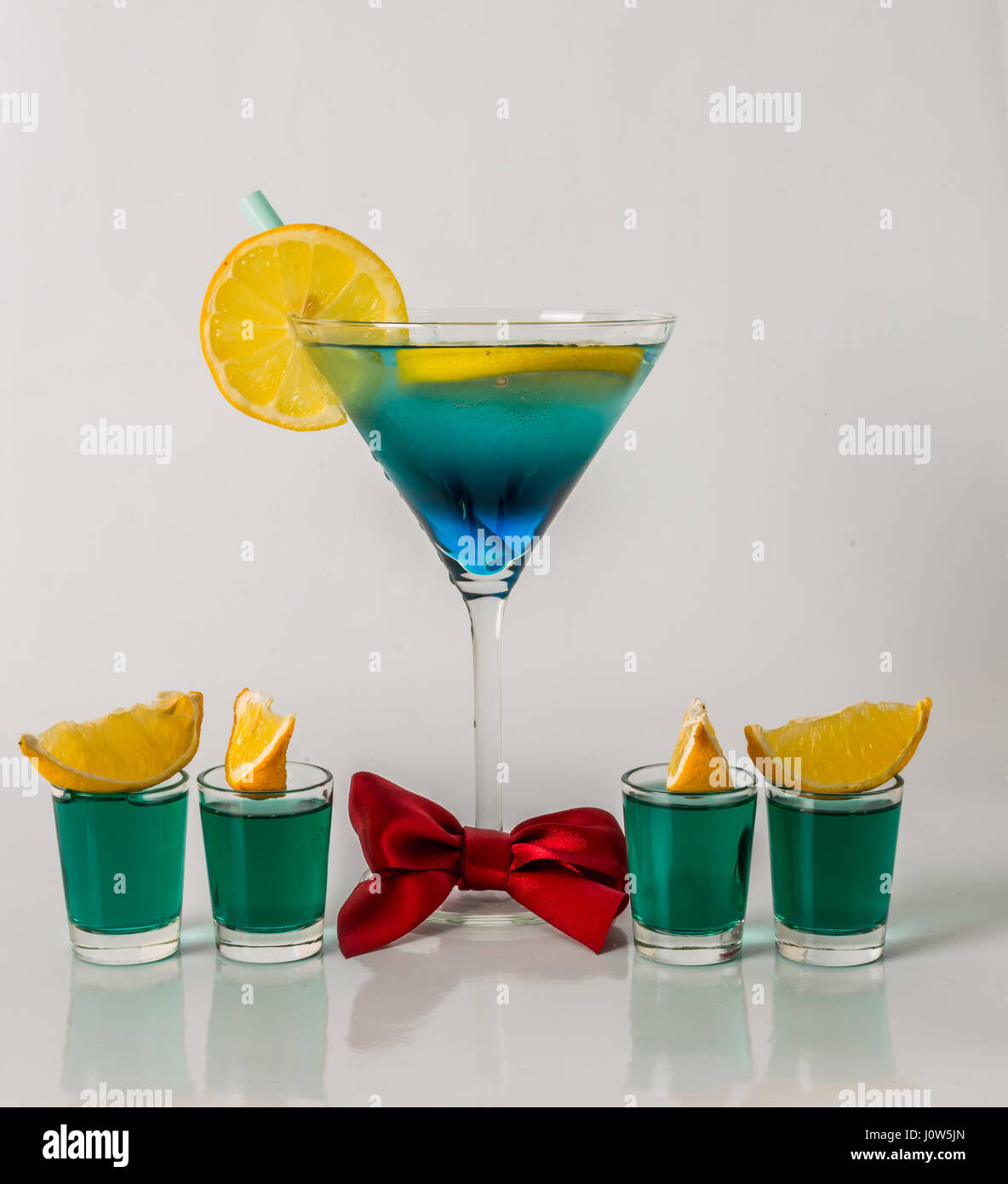 Colorful drink in a martini glass, blue and green combination, four ...
