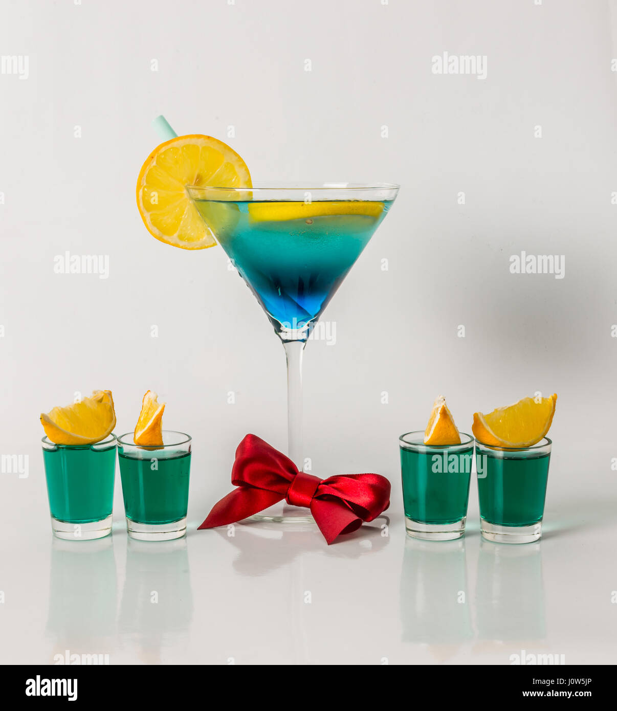 Colorful drink in a martini glass, blue and green combination, four ...