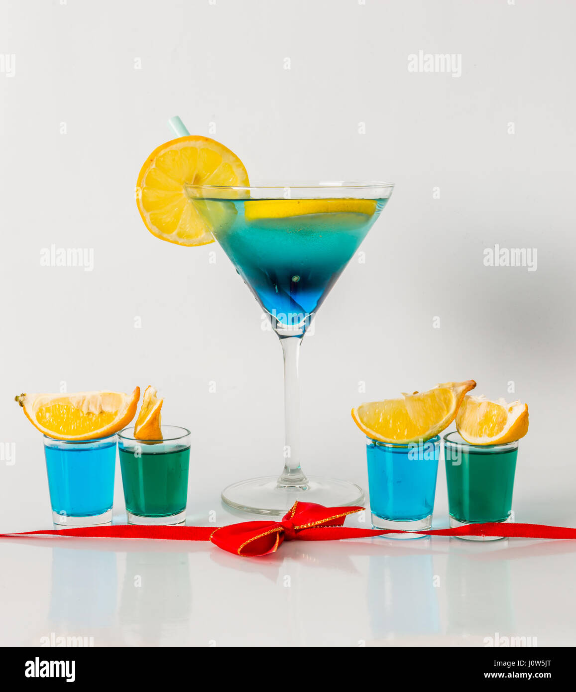 Colorful drink in a martini glass, blue and green combination, four ...