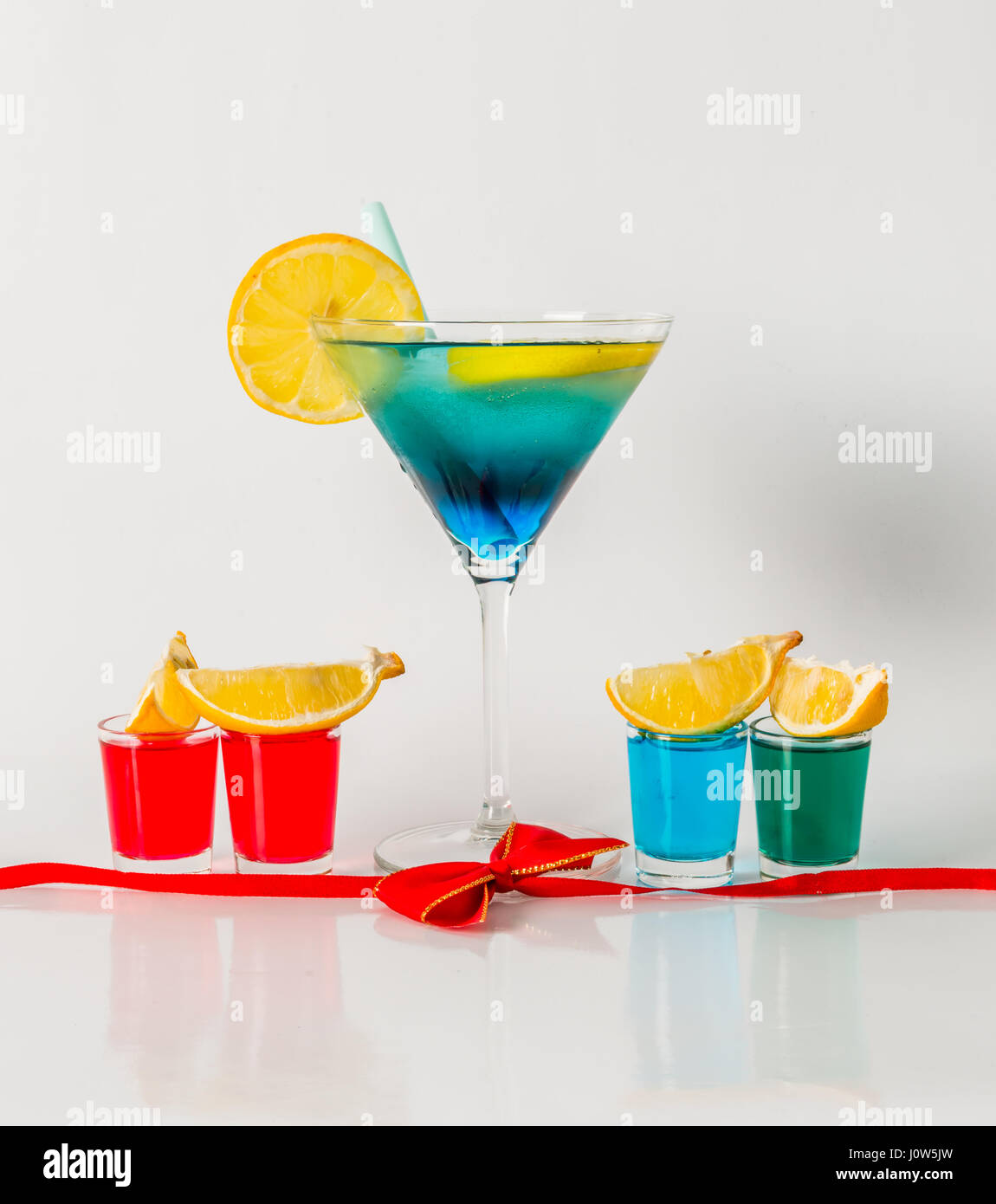 Colorful drink in a martini glass, blue and green combination, four ...