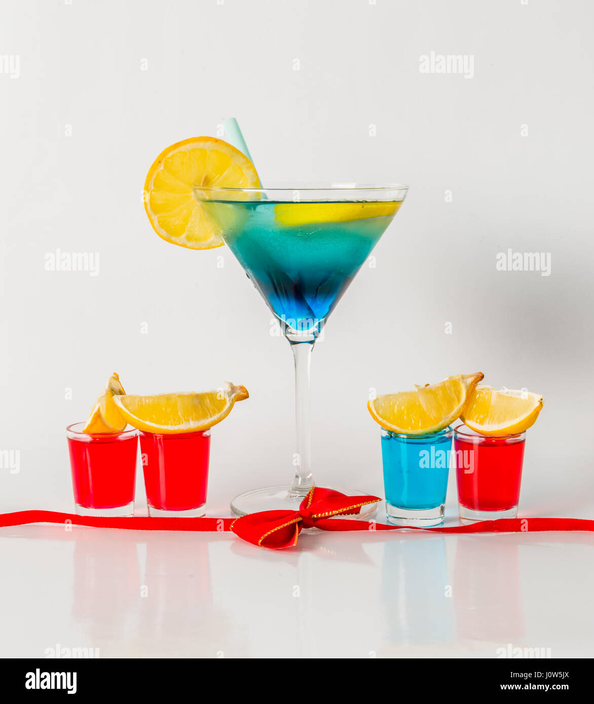 Colorful drink in a martini glass, blue and green combination, four ...