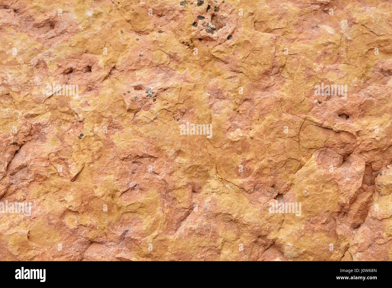Beautiful old red stone wall texture background Stock Photo - Alamy