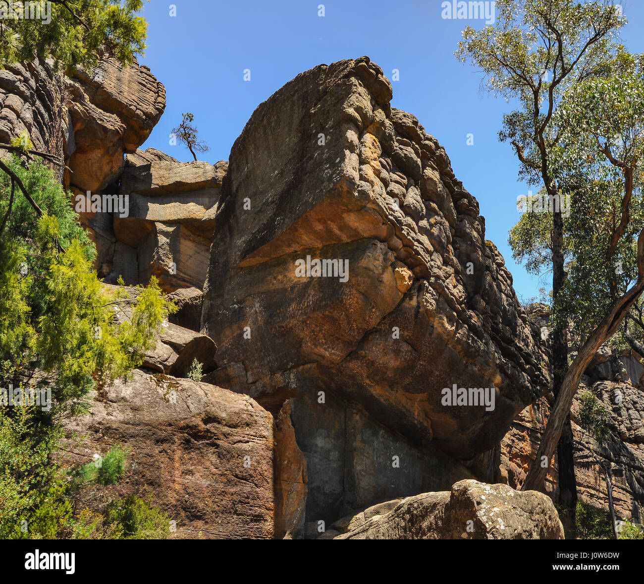 Climb to the top of a rock Pinnacle via the Grand Canyon Stock Photo ...