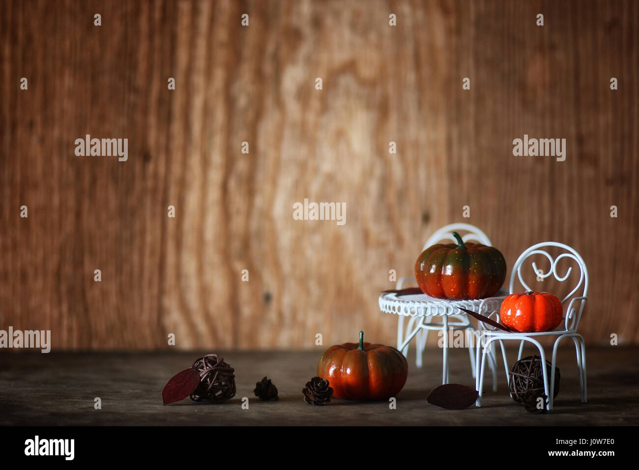 fresh pumpkin in interior wooden room on chair Stock Photo - Alamy