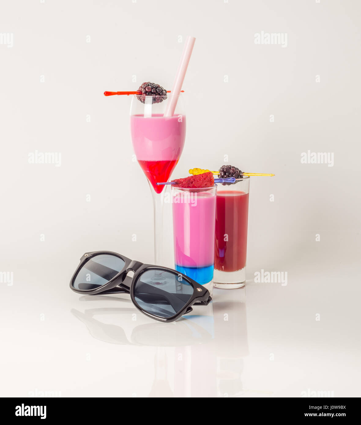 Colorful set of drinks, color drink decorated with fruit, sunglasses ...